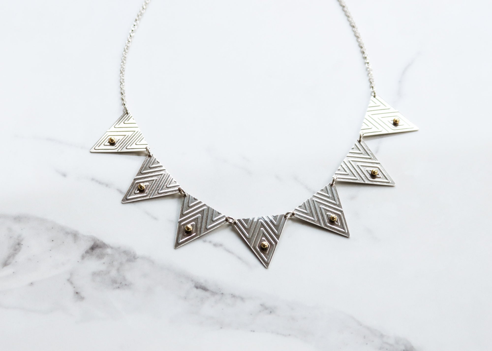 Hala Necklace - 7 Silver Geometric Pattern Triangles and Brass Balls ...